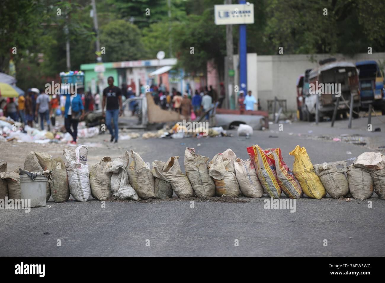 Objects set by demonstrators protesting insecurity block the street in ...
