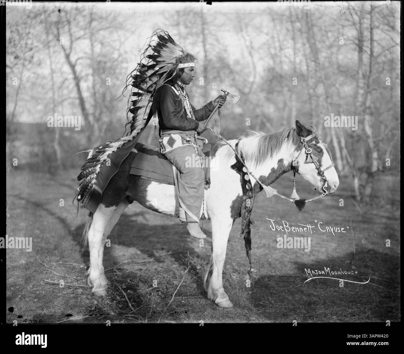The photograph depicts Joe Bennett, a 'Cayuse' man, dressed in ...