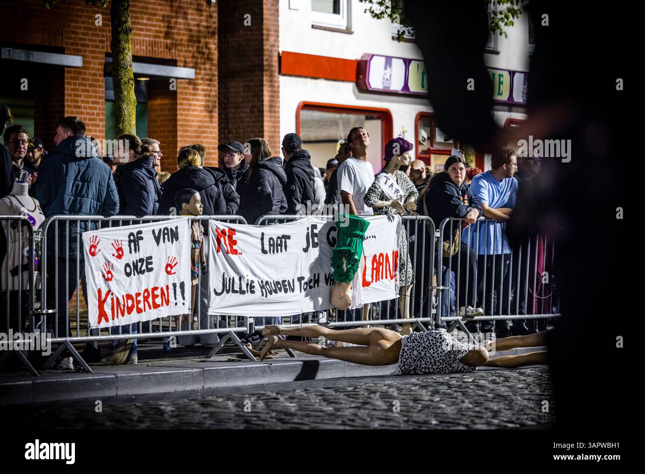 Demonstrators during a residents' meeting about a planned asylum ...