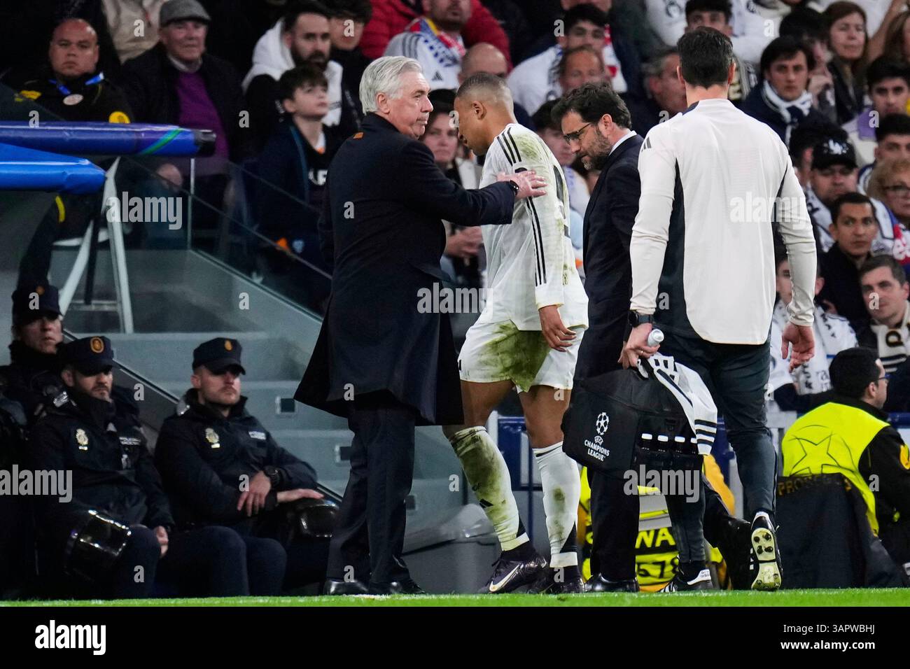 Real Madrid's Kylian Mbappe walks past Real Madrid's head coach Carlo ...