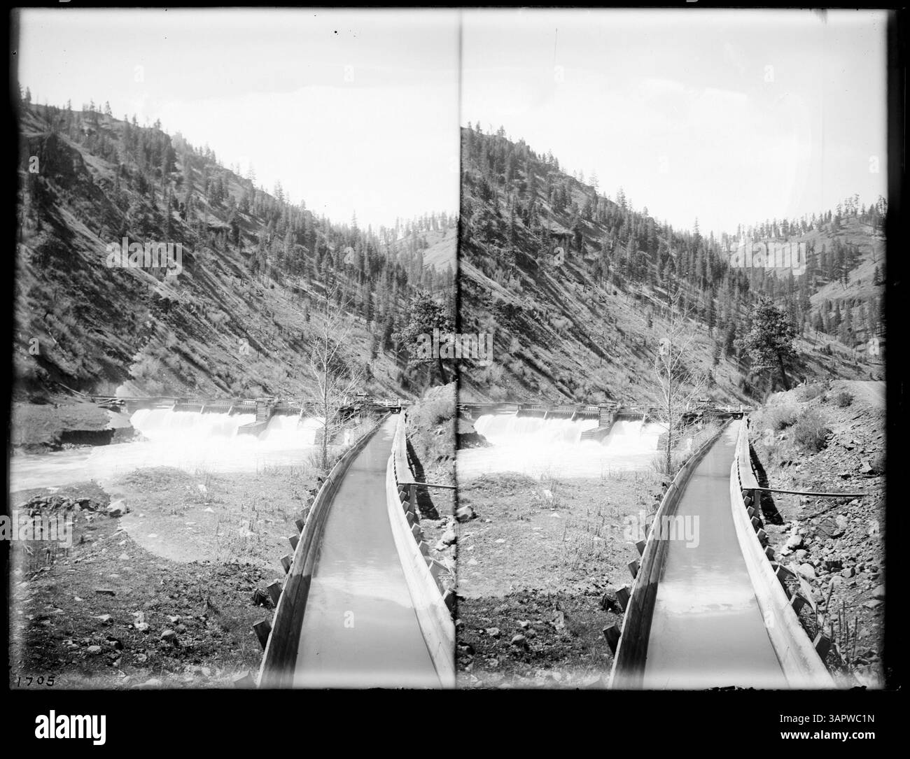 Photograph of a flume from a dam to a mill pond at a lumber mill in ...