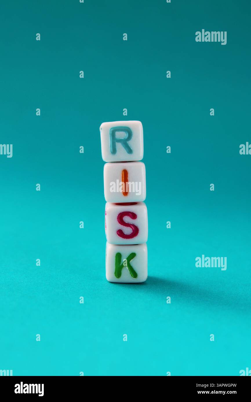 Cubes that form the word risk Stock Photo - Alamy