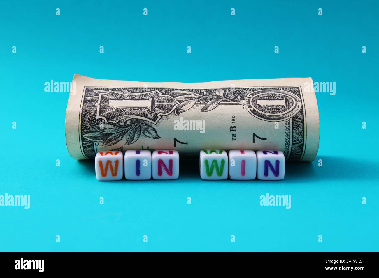 One dollar bill next to the phrase WIN WIN Stock Photo - Alamy
