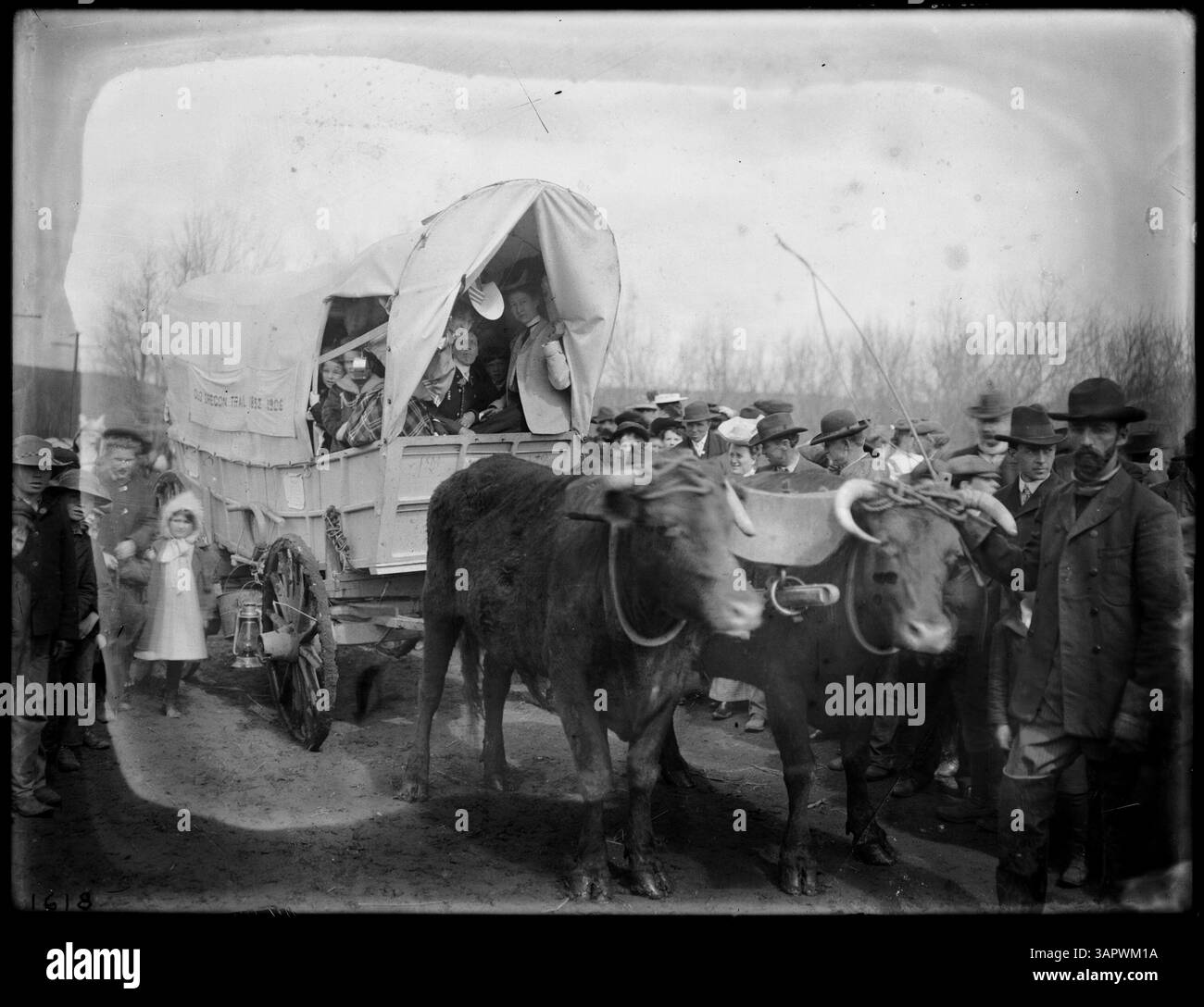 This photograph shows Ezra Meeker with a crowd of onlookers in ...