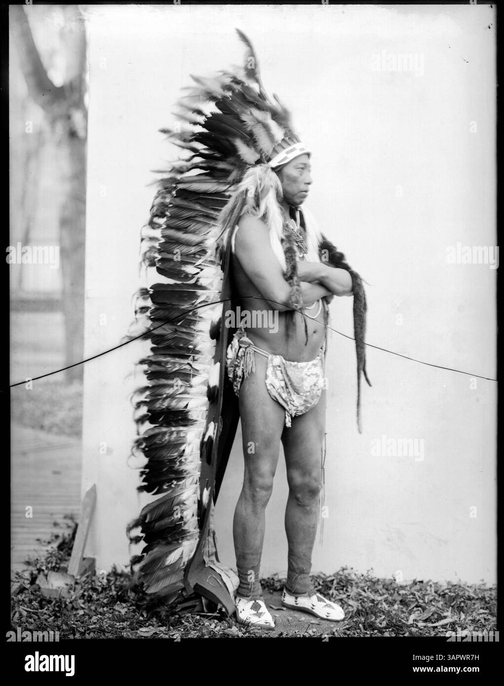 This photograph features Chief Tats Homi of the Cayuse tribe, dressed ...