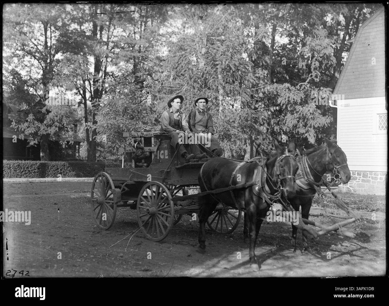 This photograph by Lee Moorhouse shows the ice wagon of Ben L. Burt in ...
