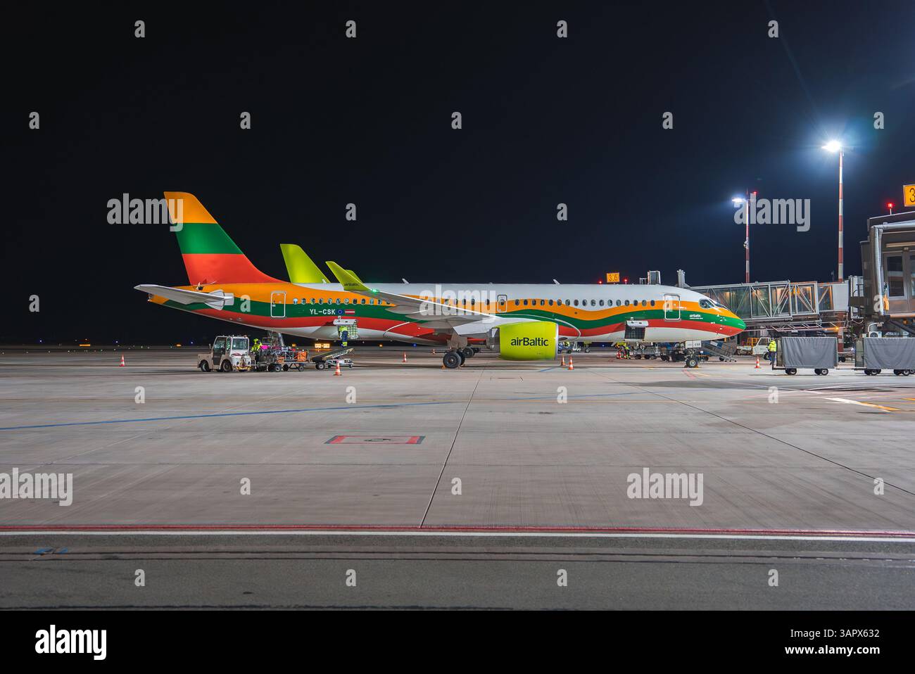 airBaltic Airplane with Lithuanian Flag Livery Parked at Night Stock ...