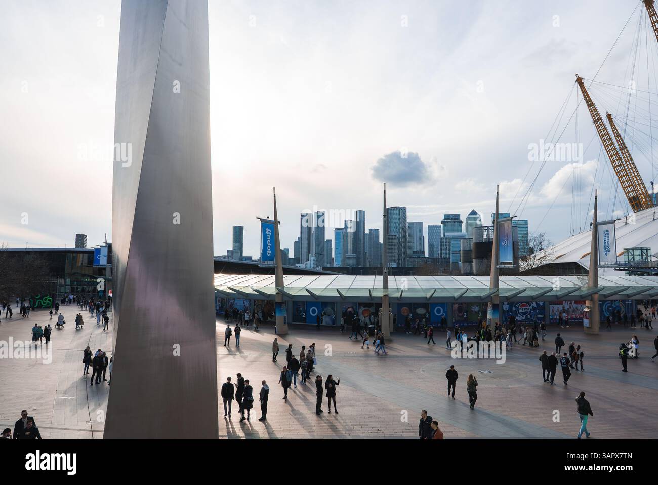 Bustling Plaza Outside O2 Arena with Canary Wharf Skyline in London ...