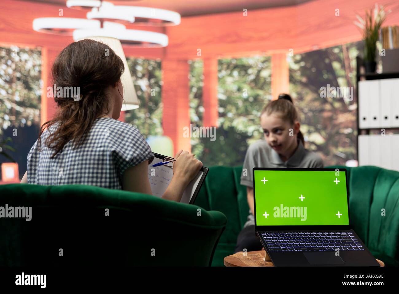 Teenager undergoing therapy for depression next to isolated chroma key ...