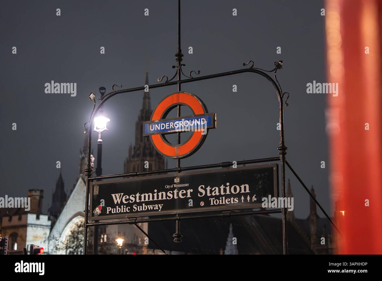 Westminster Station Sign and Palace of Westminster at Night Stock Photo ...
