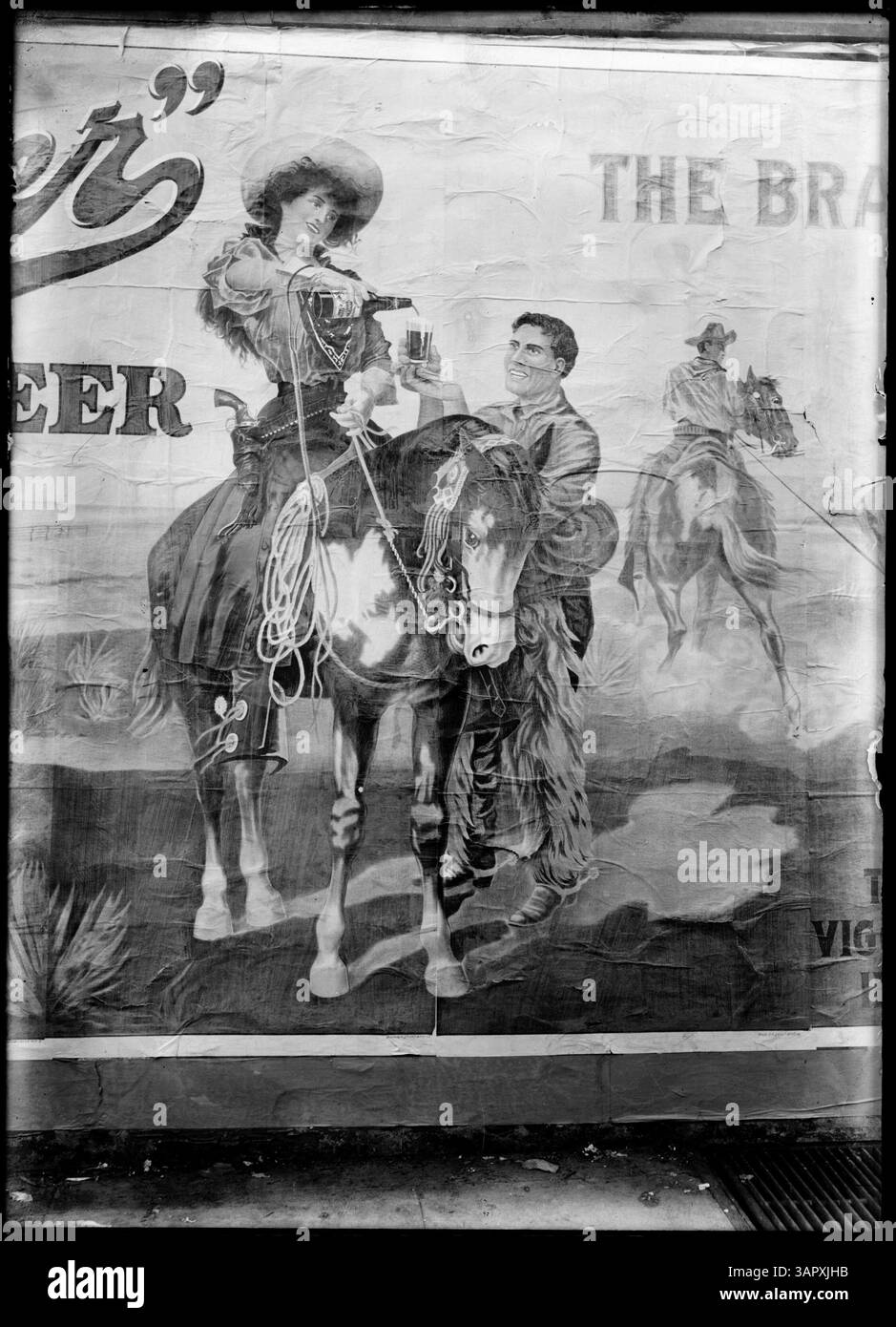 Photograph of an advertisement poster featuring a cowgirl on horseback ...