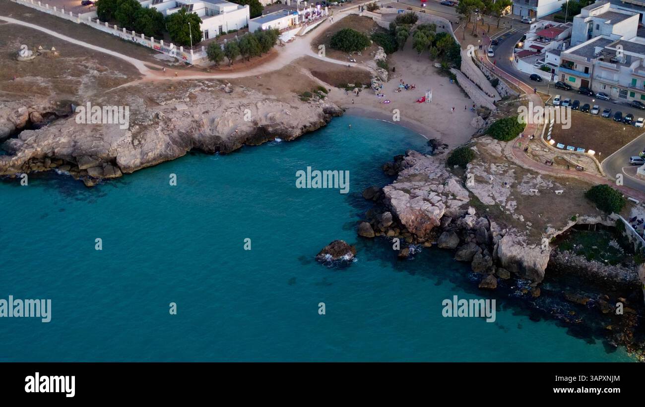 Aerial View of a Small Urban Beach with Rocky Coastline and Turquoise ...