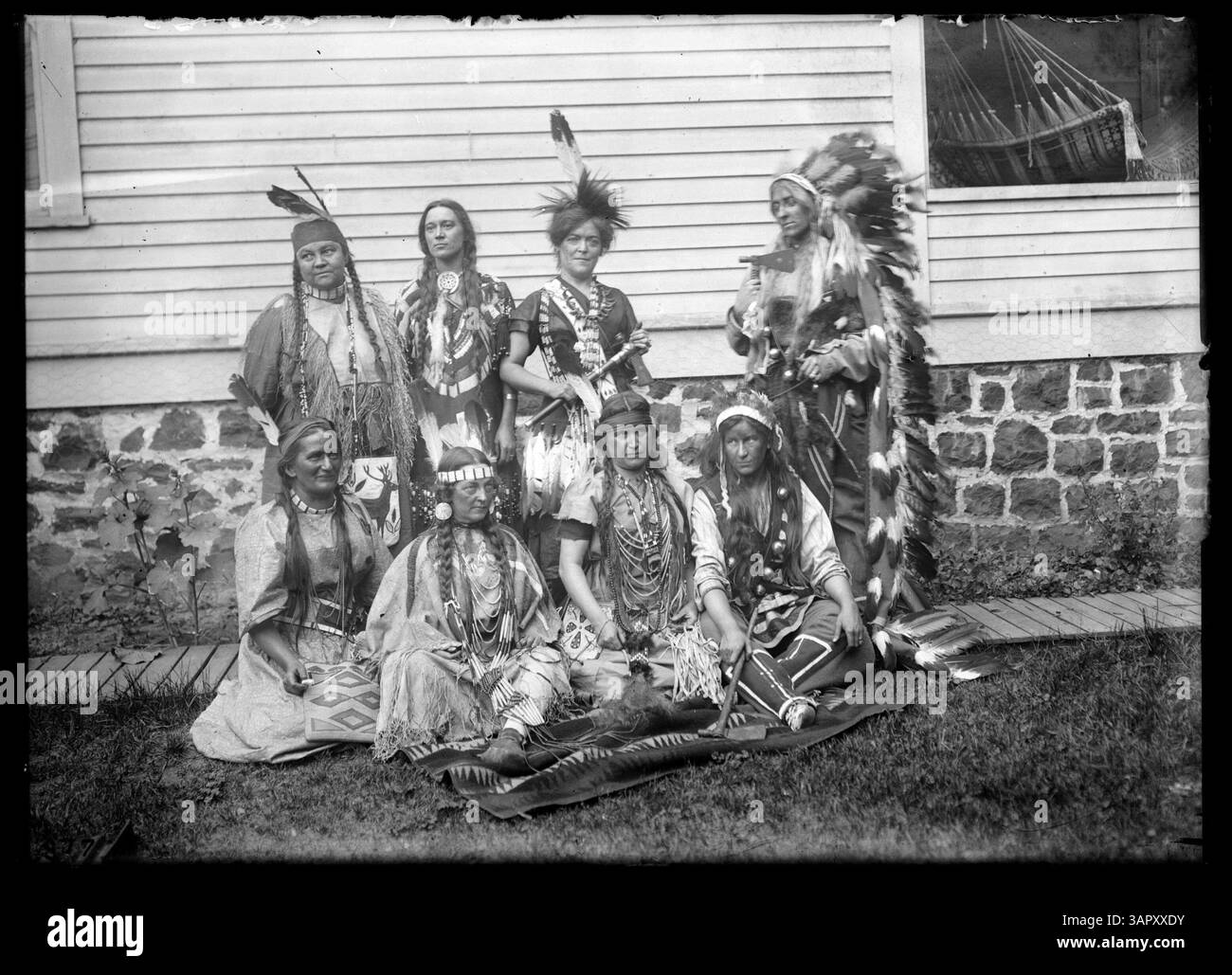 This image shows a circus troupe dressed in Indian costumes, performing ...