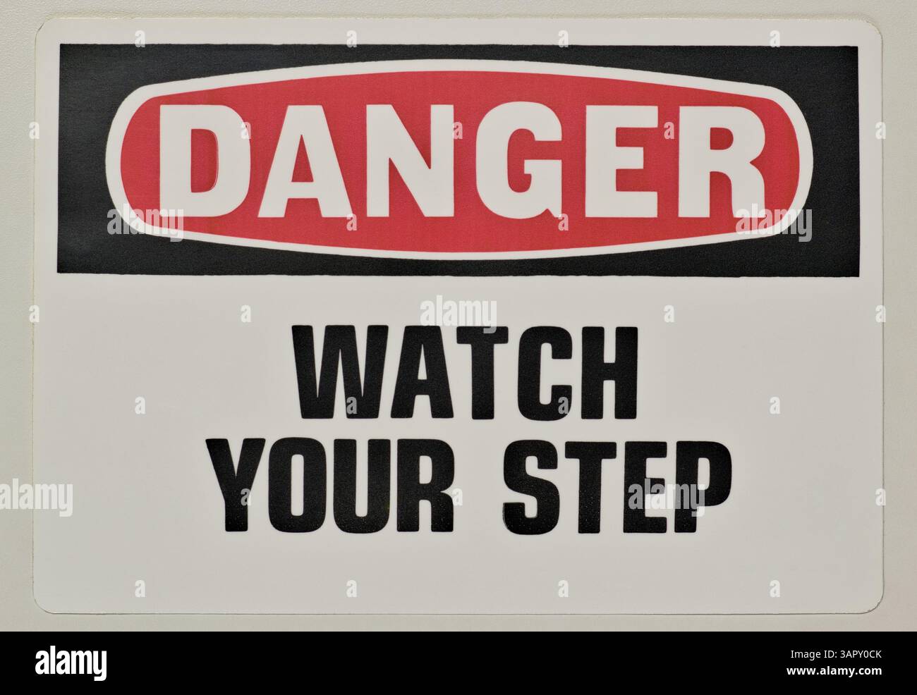 Danger watch your step safety sign notice on wall industrial occupation ...