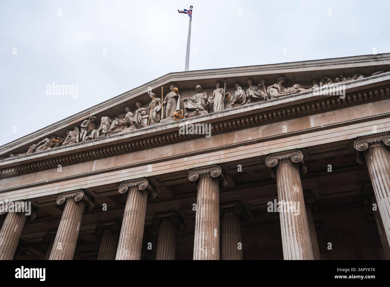 Neoclassical Building Facade with Union Jack Flag in London Stock Photo ...