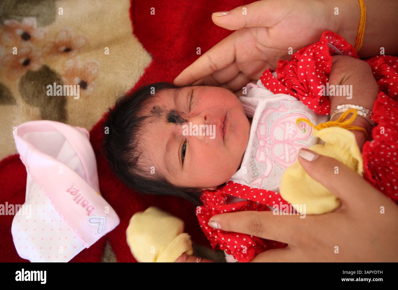 July 6, 2011 - Oakland, CA, USA - Leela Mainali tends to her new baby ...