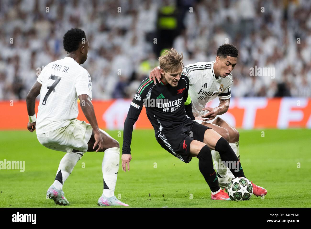 MADRID, SPAIN - April 16: Martin Odegaard of Arsenal and Jude ...