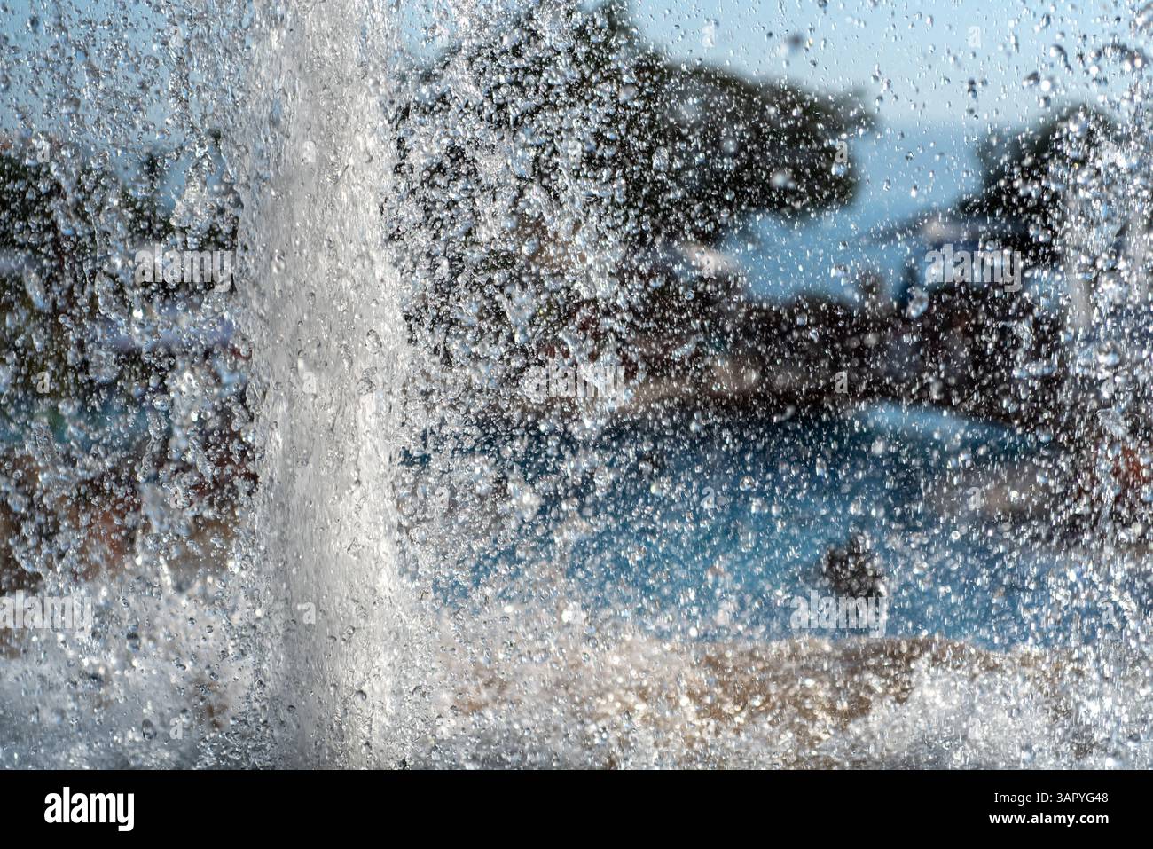 Abstract close-up of water splashing from a fountain with dynamic ...