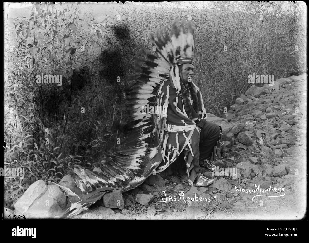 James Reubens, a Nez Perce man, is shown in full costume, including a ...