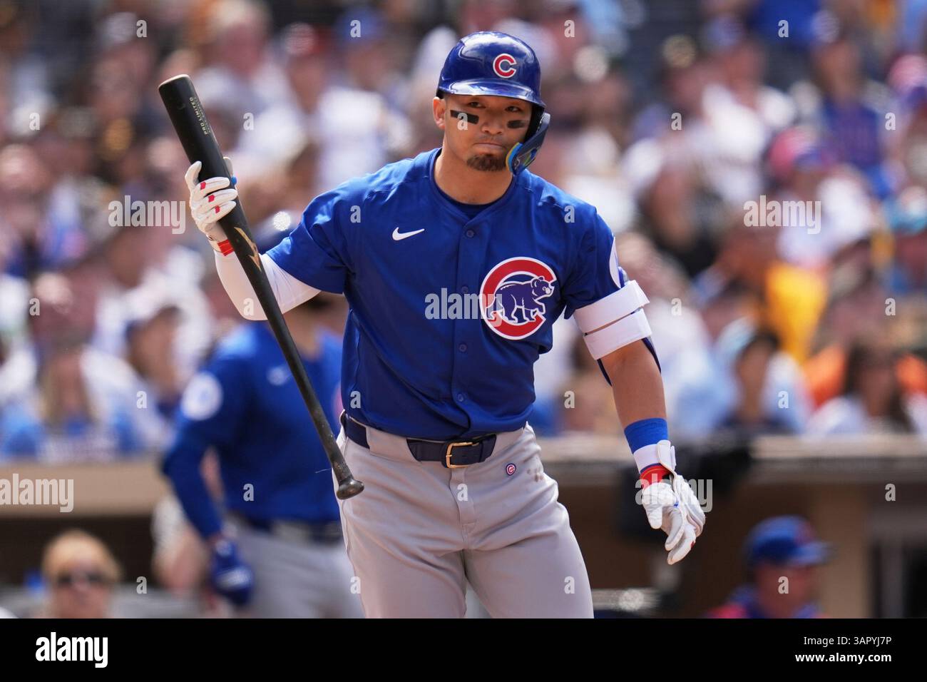 Chicago Cubs' Seiya Suzuki throws his bat as he pops out during the ...