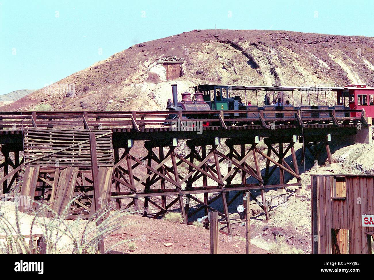 Calico, California, U.S.A., approx. 1985. Train with tourists on the Odessa Railroad narrow ...