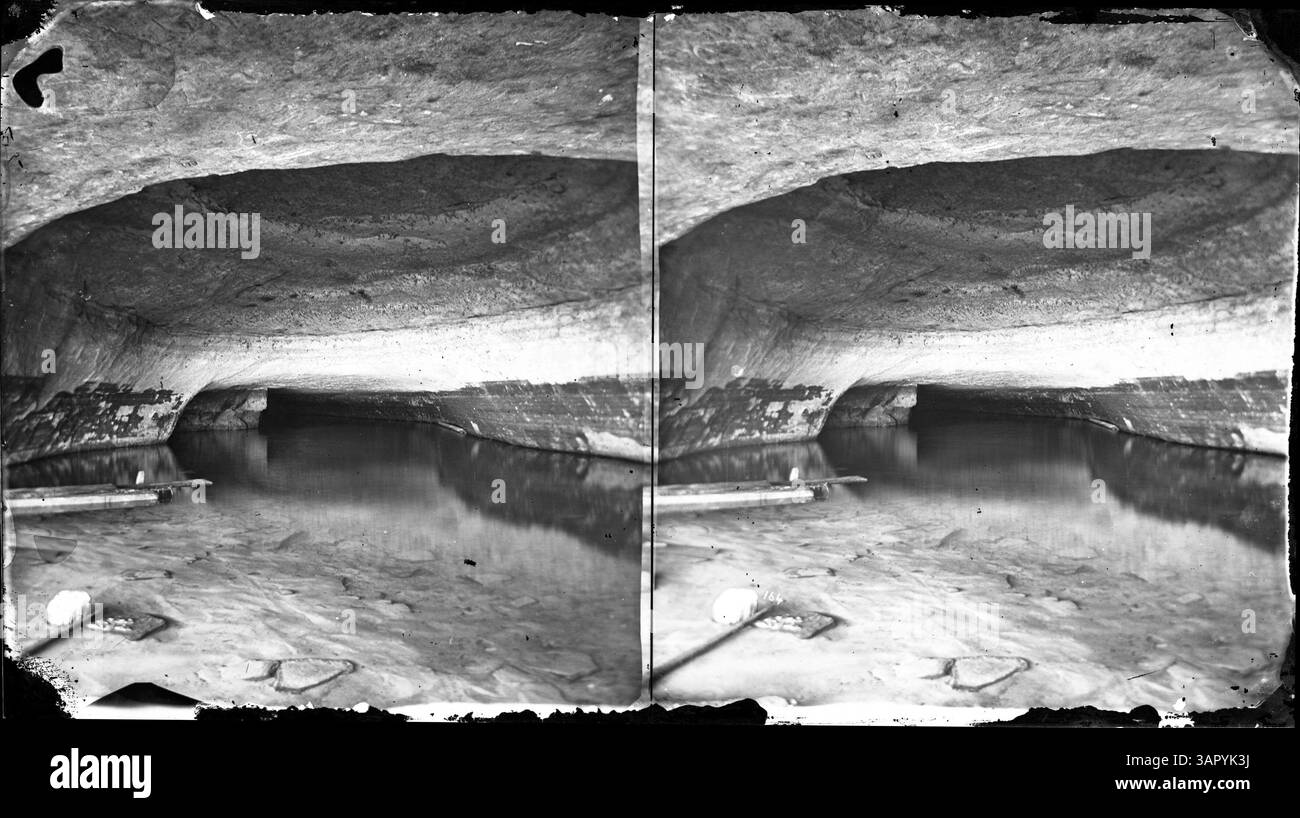 The image captures the interior of Fountain Cave, featuring a stream ...