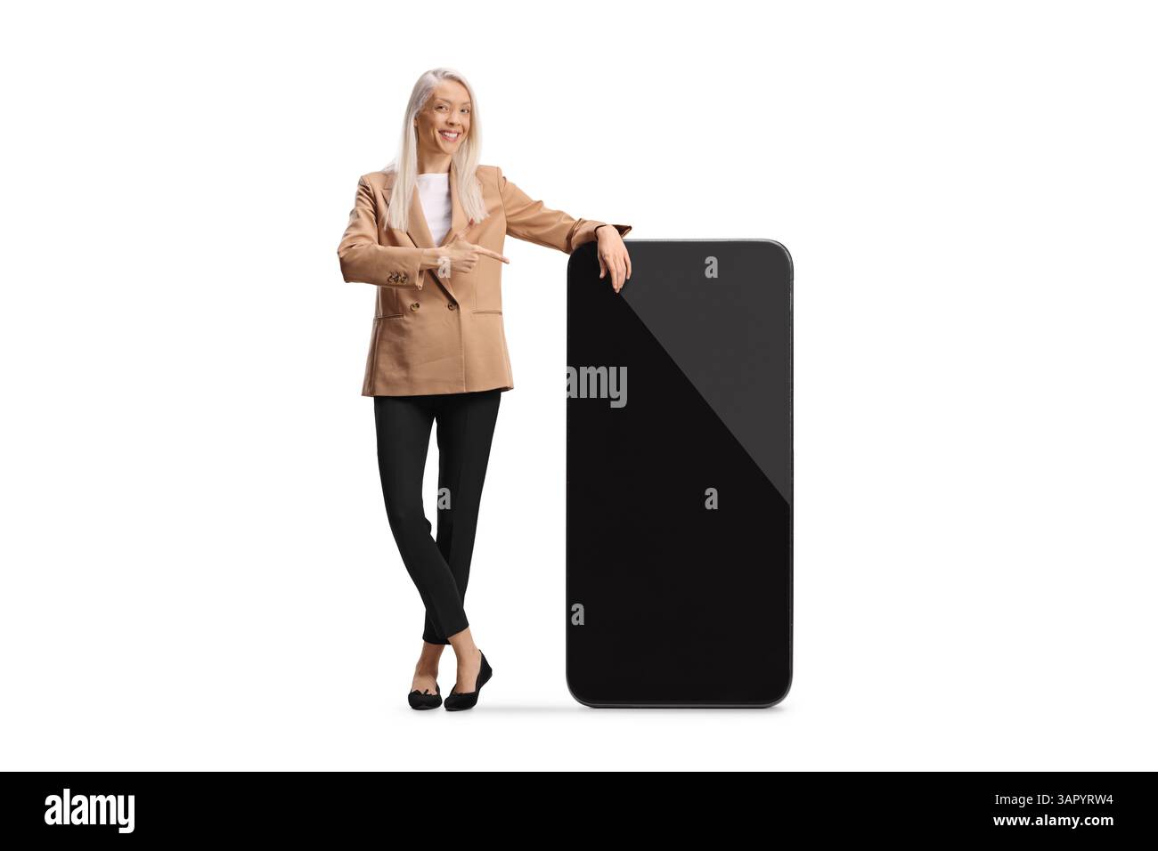 Tall woman pointing at a big mobile phone isolated on white background ...