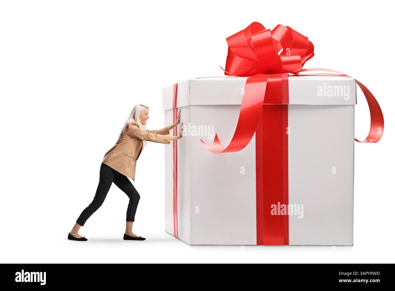 Woman pushing a big present isolated on white background Stock Photo ...