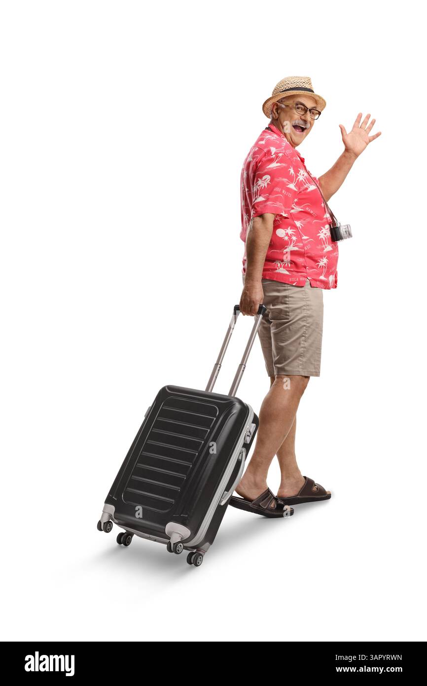 Tourist pulling a suitcase and waving isolated on white background ...