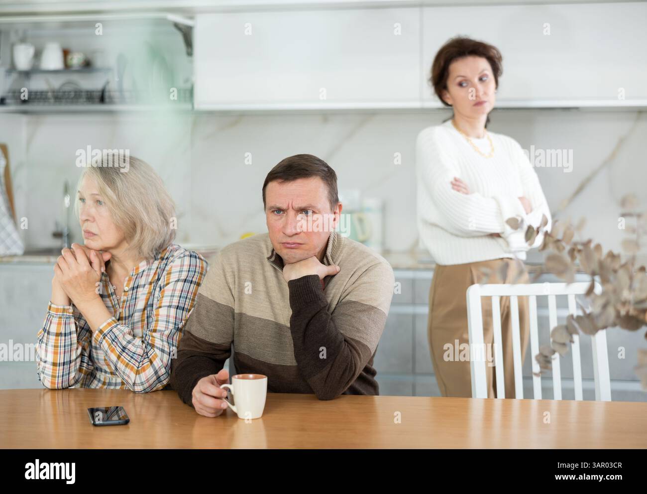 Family quarrel of three people Stock Photo - Alamy