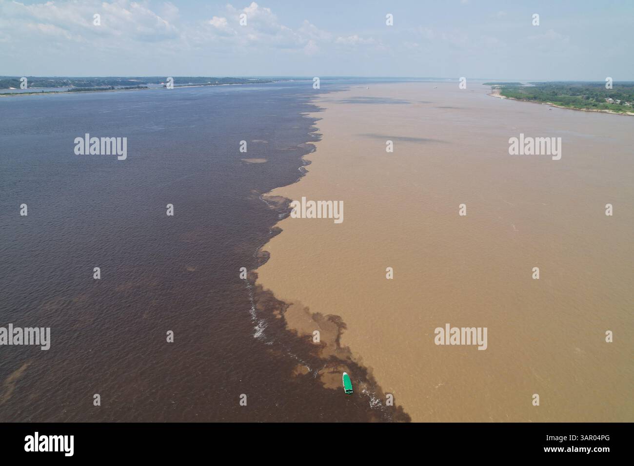 River confluence showing distinct color difference in water at Amazon ...