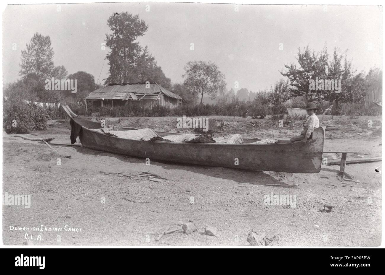 This image shows a Duwamich Indian canoe, an important artifact ...