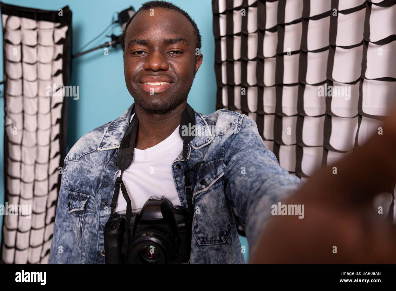 African american man records himself in a studio with photography ...