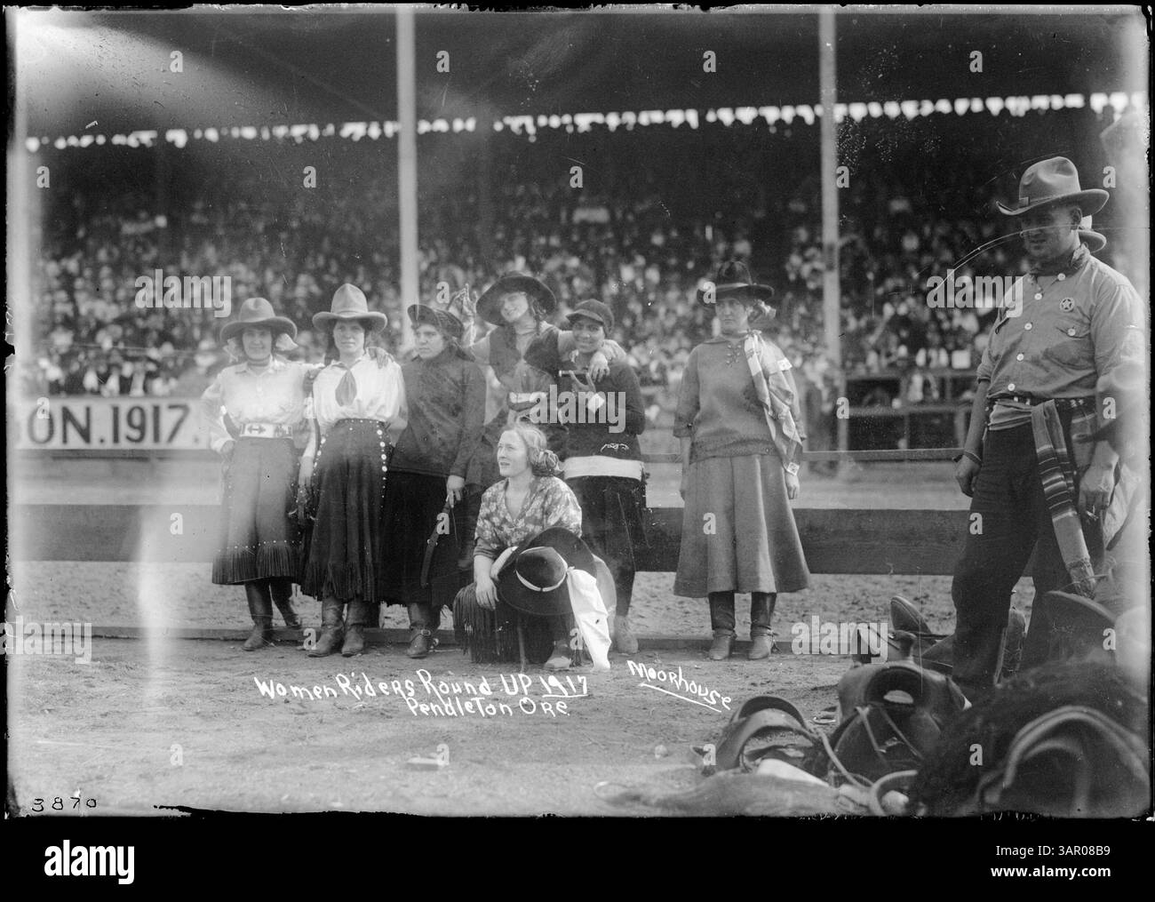 This photograph by Lee Moorhouse shows cowgirls participating in a ...