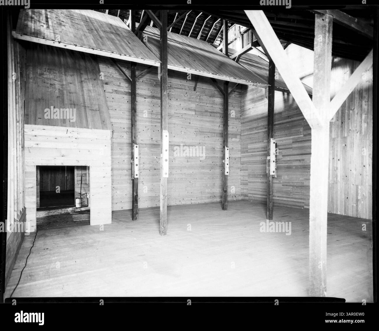 Photograph depicting a factory interior, showing machinery and workers ...