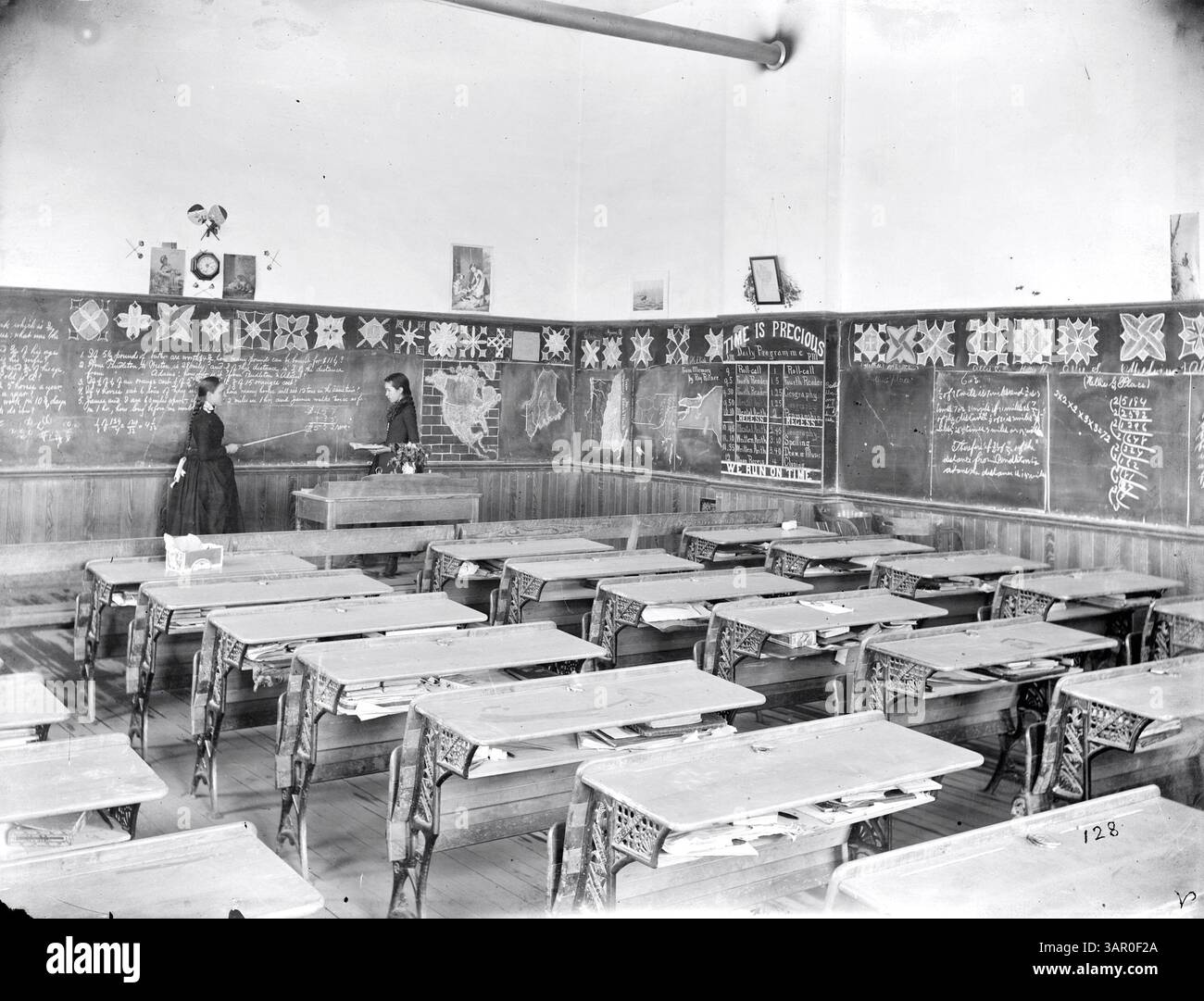 A black and white photograph by Walter S. Bowman of two girls in a ...