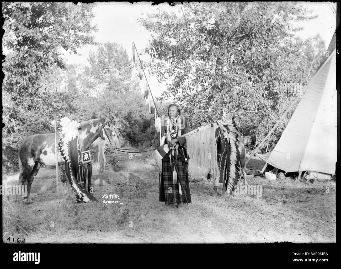 A Walla Walla Indian named Sequyene is depicted in traditional regalia ...