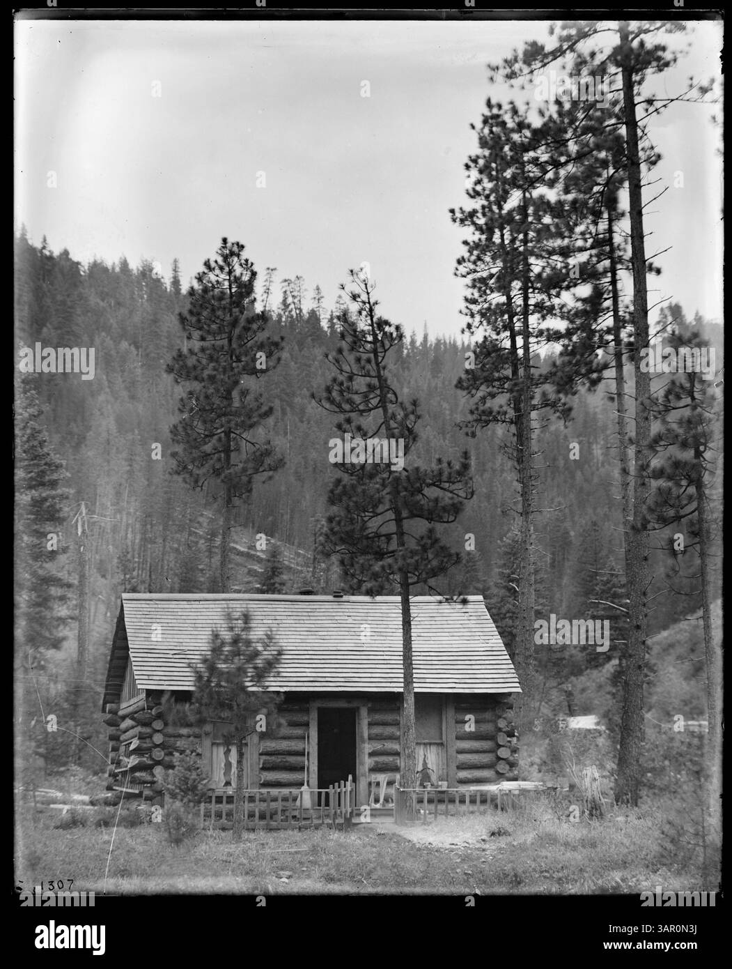 A photograph of a woodchopper's log cabin in Huron, Oregon, reflecting ...