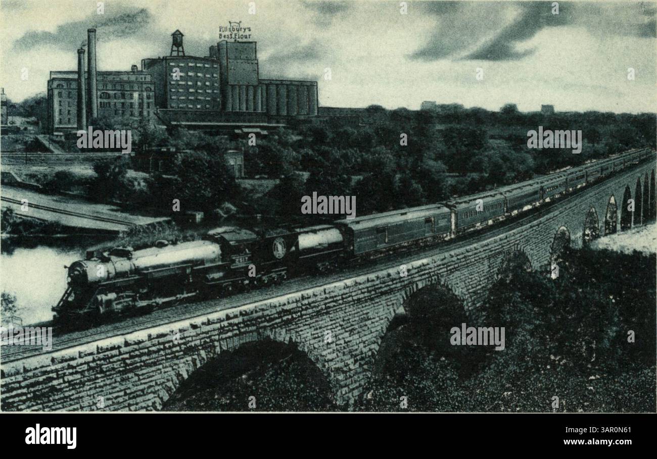 The 'Empire Builder' train crosses the historic Stone Arch Bridge in Minneapolis, Minnesota. The ...