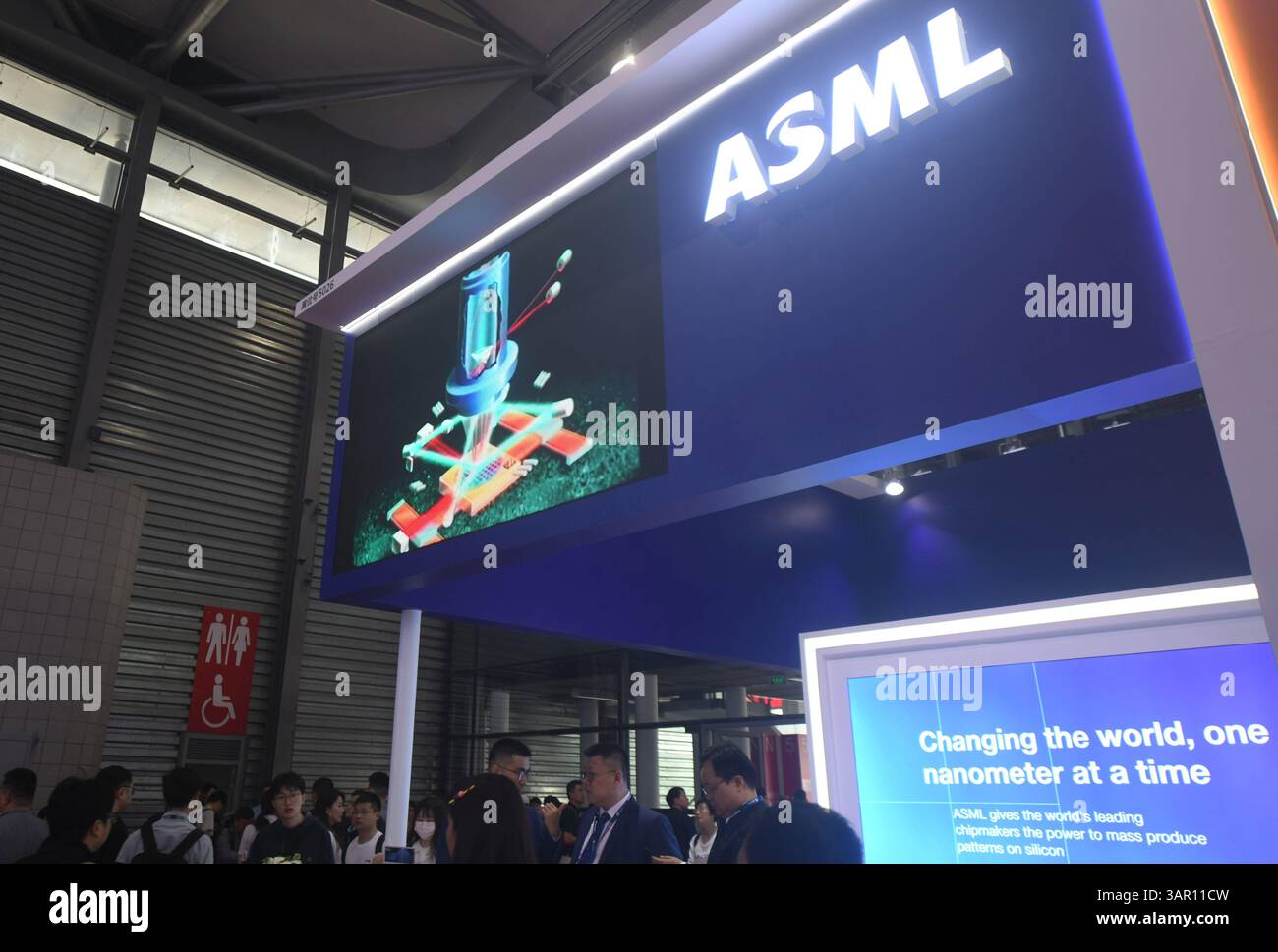 SHANGHAI, CHINA - MARCH 26, 2025 - Visitors visit the stand of ASML at ...