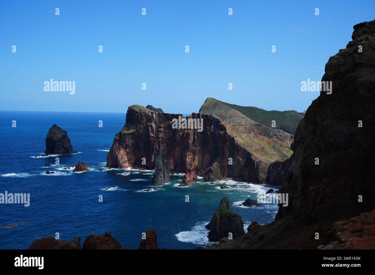 Stunning view of the dramatic volcanic cliffs and sea stacks at Ponta ...