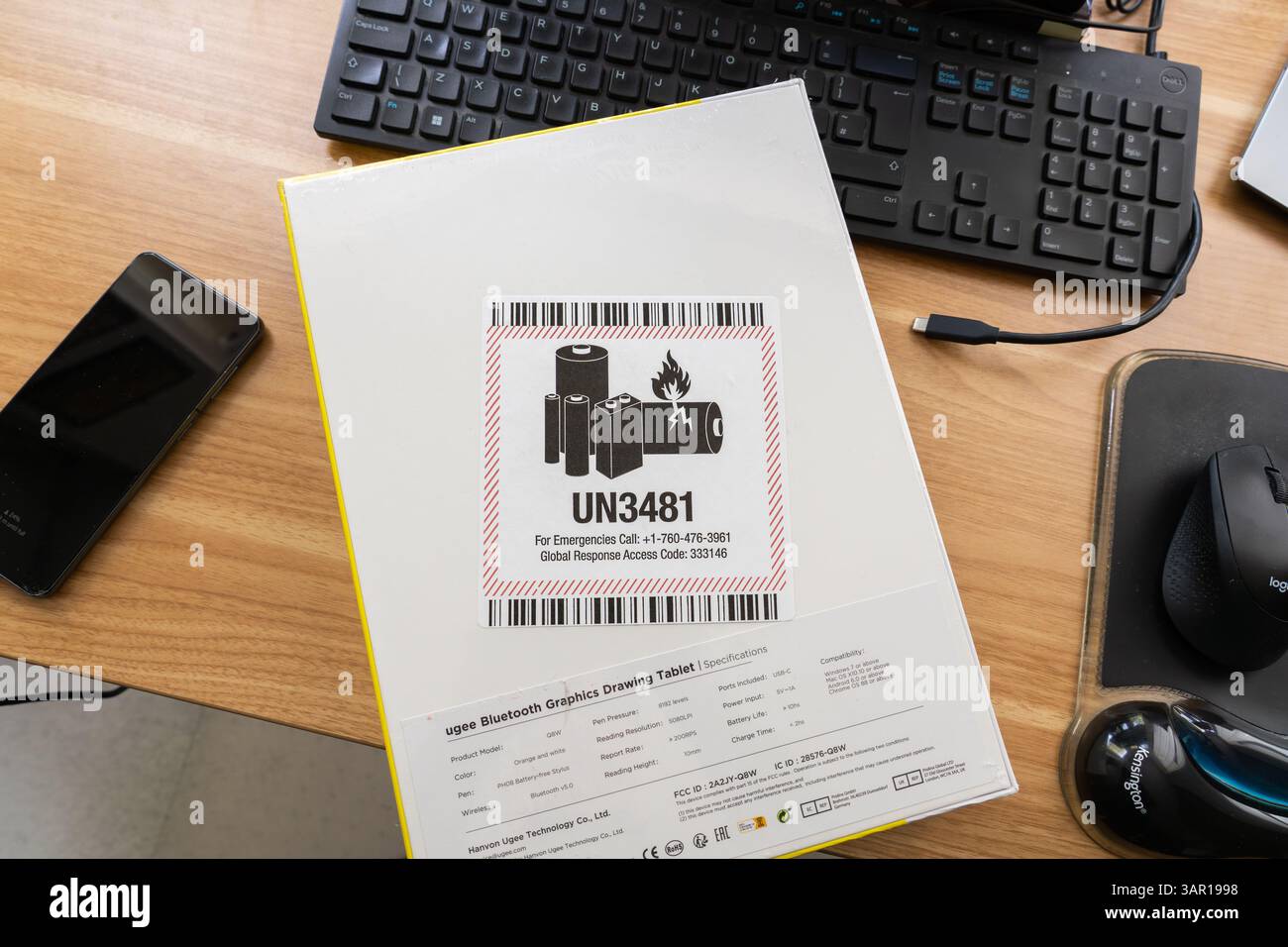 Package with graphics tablet containing lithium ion batteries with UN3481 label labelling the ...