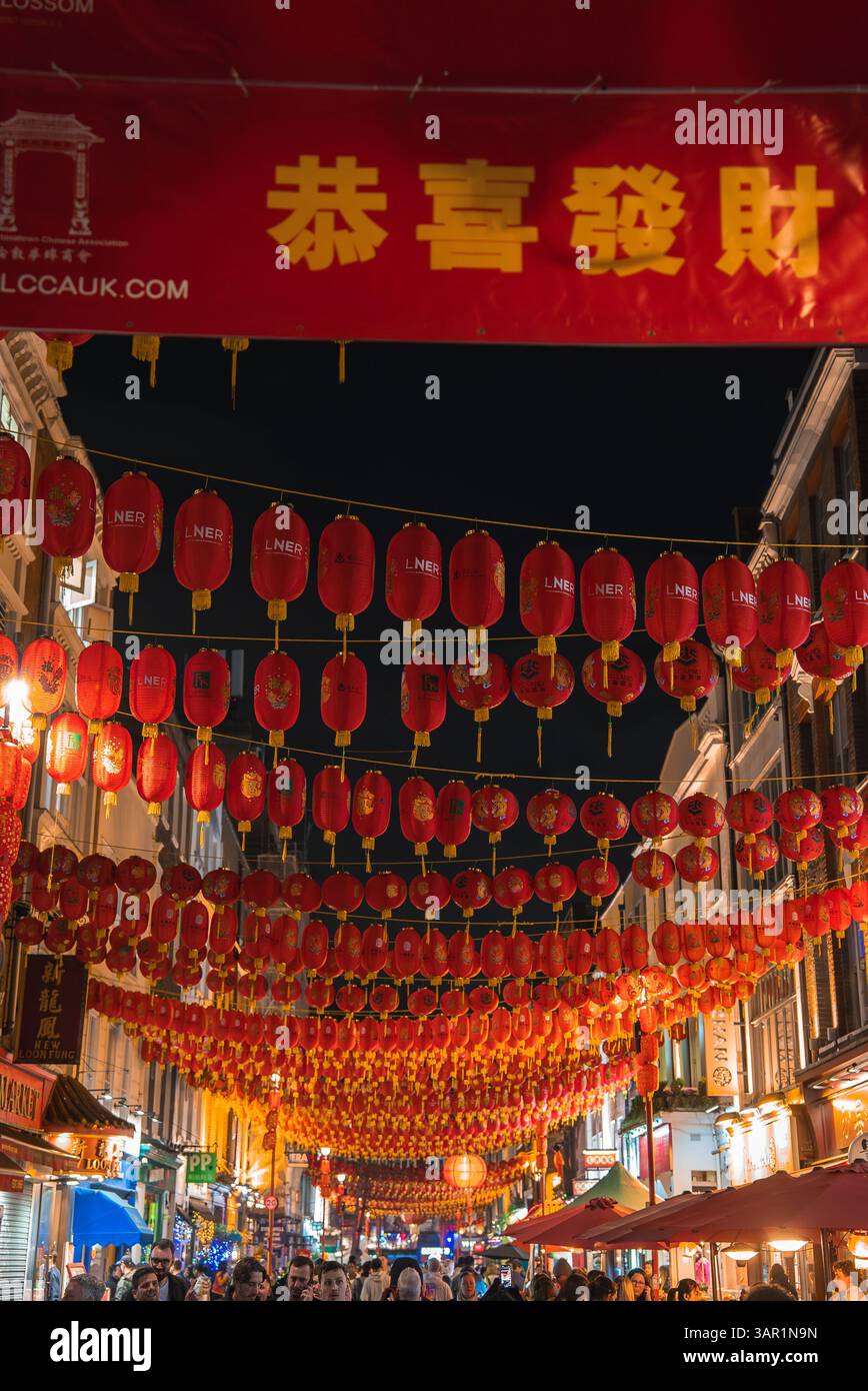 Nighttime View of London's Chinatown with Red Lanterns and Crowds Stock ...