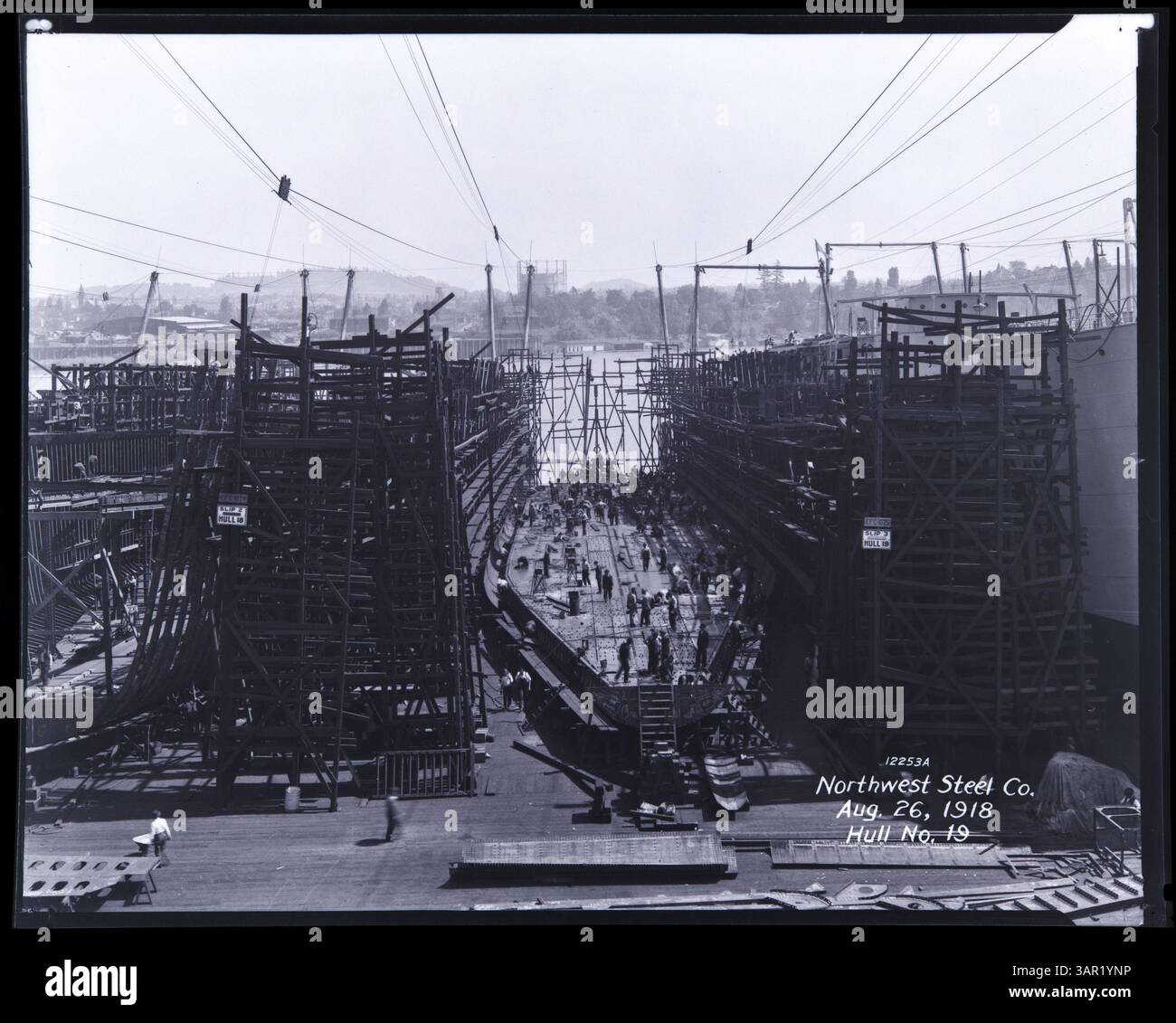 This photograph captures workers from Northwest Steel Co. engaged in ...