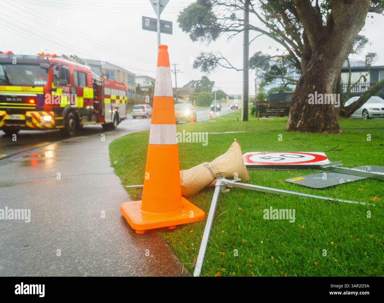 Auckland, New Zealand – April 17, 2025: Fire truck driving past traffic ...
