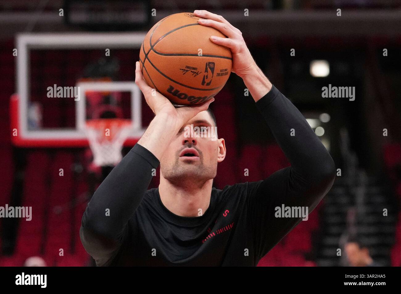 Chicago Bulls center Nikola Vucevic warms up before an NBA play-in ...