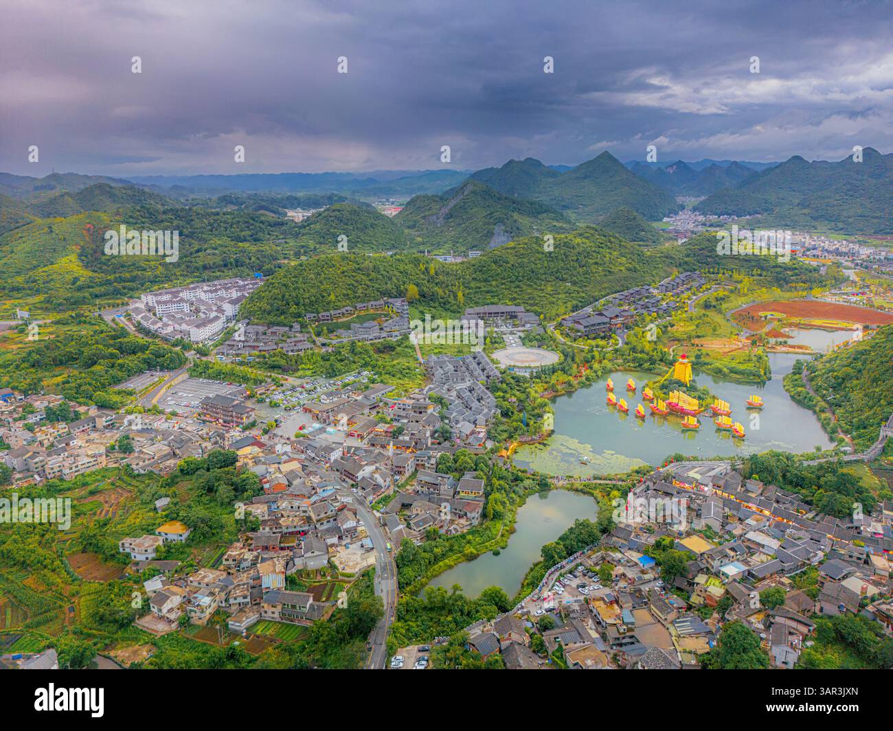 The pond with ships and streets of Qingyan Ancient Town, one of the top ...
