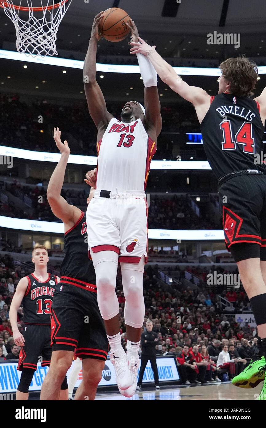 Miami Heat center Bam Adebayo, center, goes up for a shot against Chicago Bulls center Nikola ...
