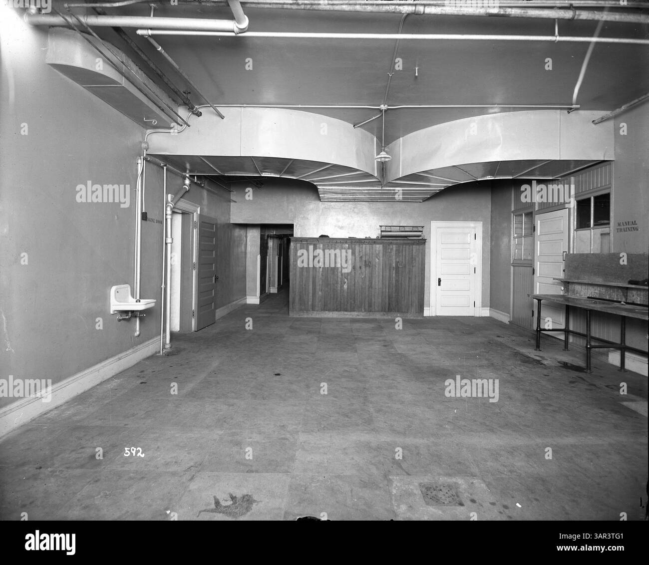 This image captures the basement hallway of Douglas School, showcasing ...