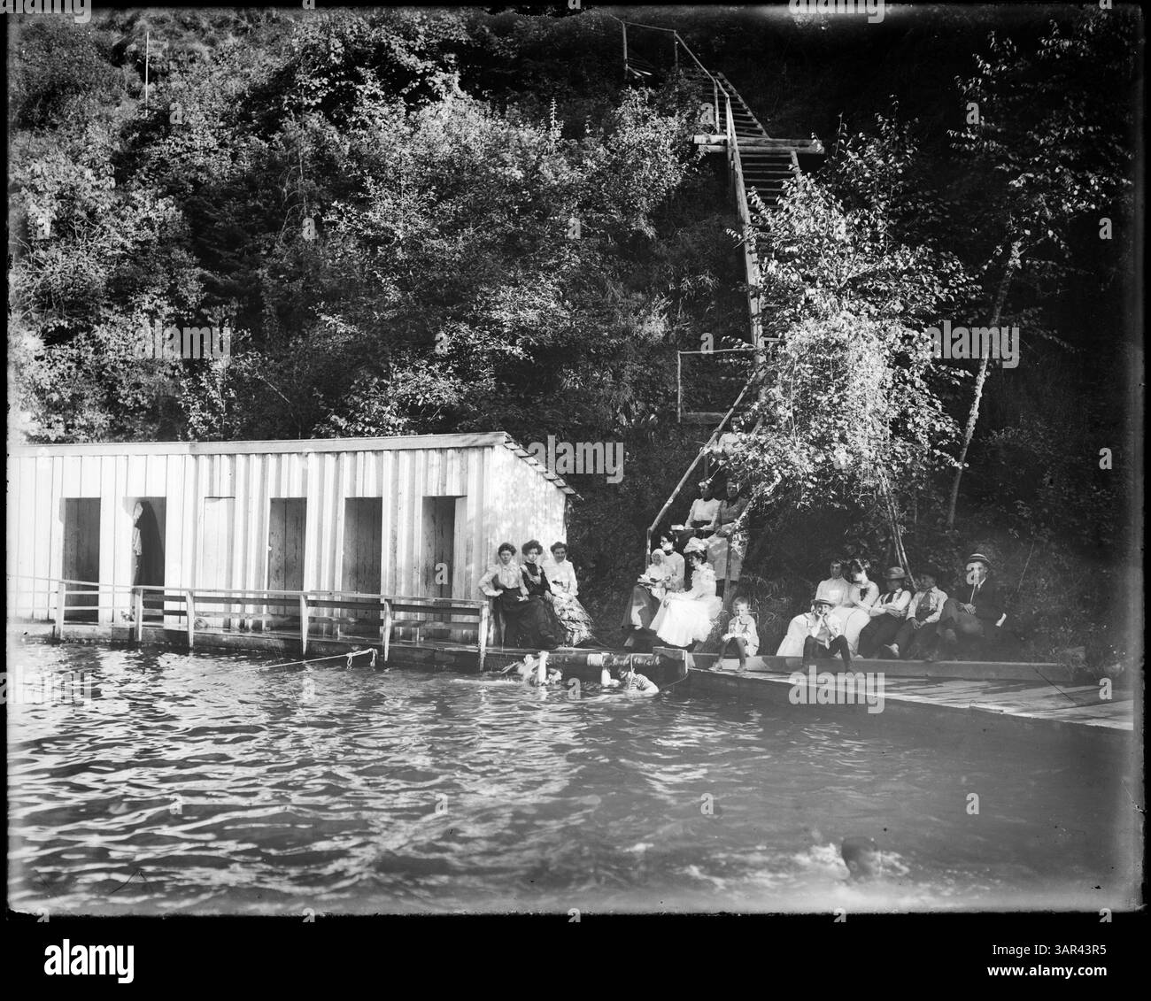 Photograph of a lake and resort area, with people swimming at Bingham ...